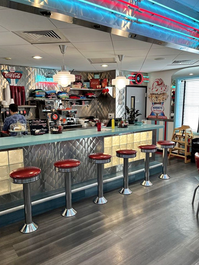 The counter where milkshake dreams come true. Those stools have witnessed first dates, family outings, and countless "I shouldn't, but I will" dessert decisions.