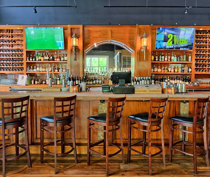 A bar stocked better than most people's retirement portfolios. The TVs ensure you won't miss the game while expanding your palate.
