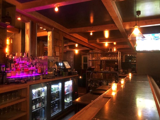 A bar that glows with promise and possibility. Those bottles aren't just spirits&mdash;they're supporting characters in your evening's narrative.