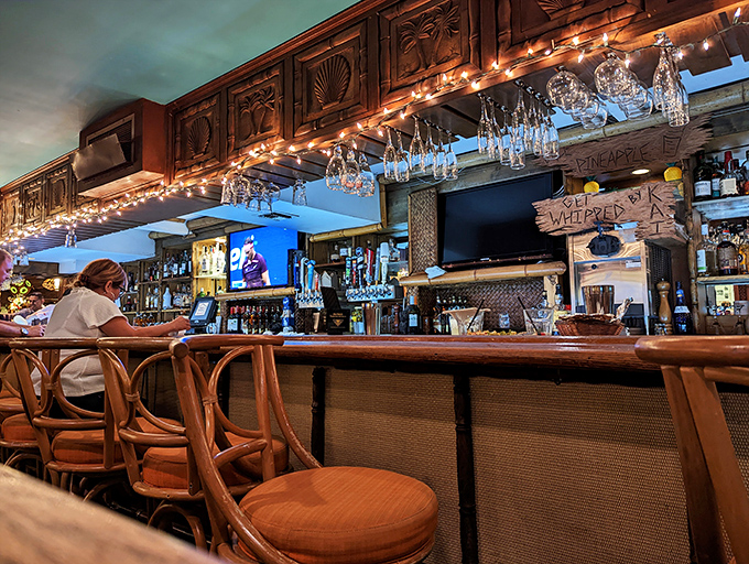 The ornate bar beckons with carved details and promises of perfectly mixed drinks to complement dinner.