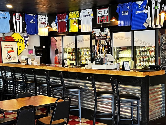 The bar area feels like a Premier League clubhouse, where soccer jerseys create a colorful canopy above perfectly poured pints.