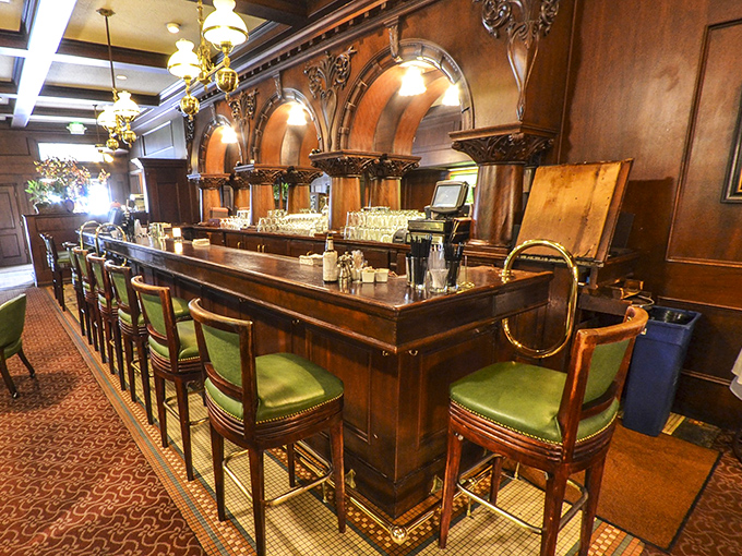 The bar area gleams with old-world sophistication, where cocktails are crafted with the same care as the steaks.