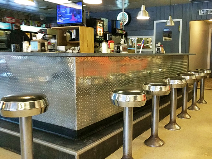 A counter where solo diners never feel alone. These stools have supported the weight of both travelers and their stories.