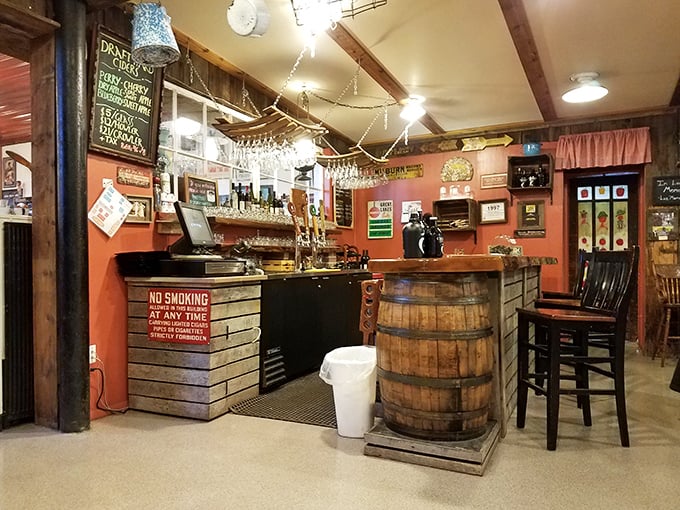 The bar area, with its barrel accents and coral walls, feels like the perfect blend of farmhouse charm and small-town tavern conviviality.