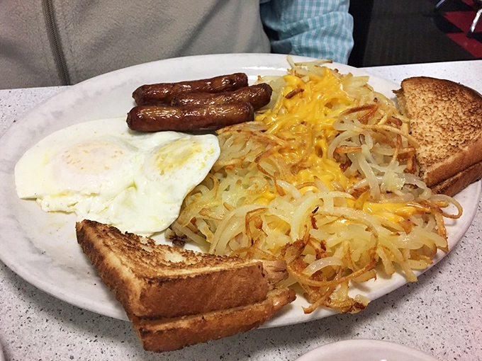 The breakfast trinity &ndash; sausage links, sunny-side up eggs, and hash browns with cheese that would make even non-morning people set an alarm.