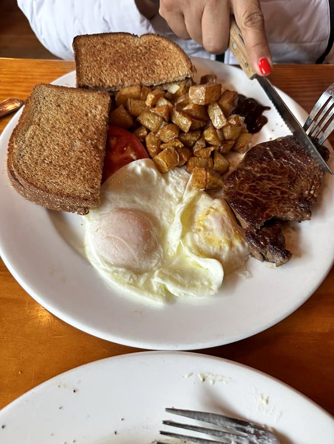 The breakfast trinity - eggs, toast, and potatoes - performed with the precision of a classical orchestra.