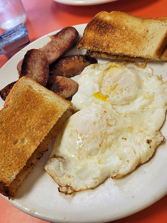 Breakfast done right doesn't need avocado toast or acai bowls. Just perfectly fried eggs, sausage links, and toast that's actually toasted.
