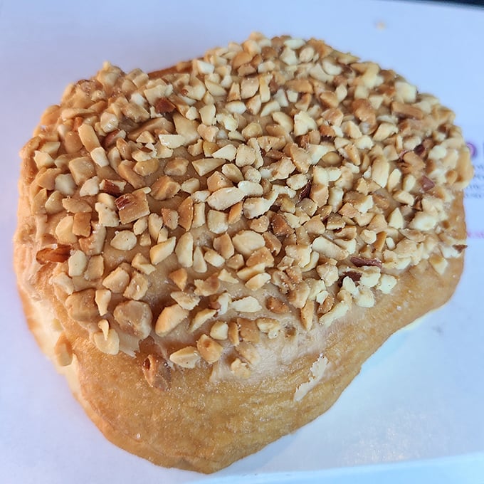 Caramel and nuts create a sweet armor around this donut. Like a crunchy, sweet helmet protecting the tender dough beneath.