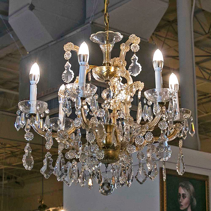 Crystal chandeliers that make you wonder if your living room ceiling could support something more ambitious than that basic fixture from the home improvement store.