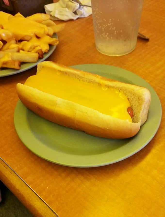 The cheese dog&mdash;where mustard-yellow meets pillowy bun in a relationship that makes modern dating look unnecessarily complicated.