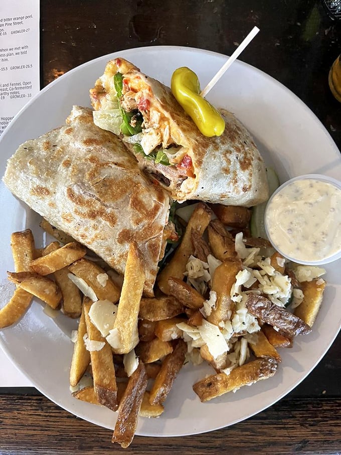 This isn't just a wrap&mdash;it's a carefully constructed flavor bomb with crispy fries standing guard alongside, ready for dipping duty.