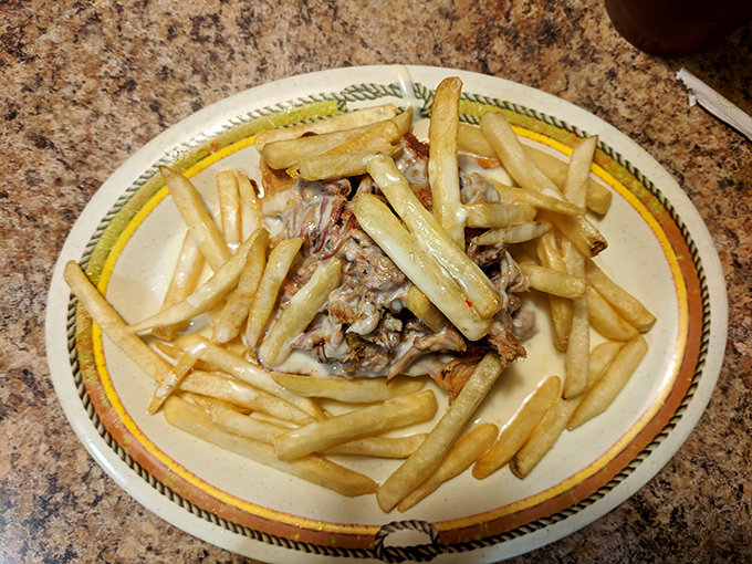 Fries ascend to their highest calling when topped with pulled pork&mdash;a culinary promotion from side dish to main event.