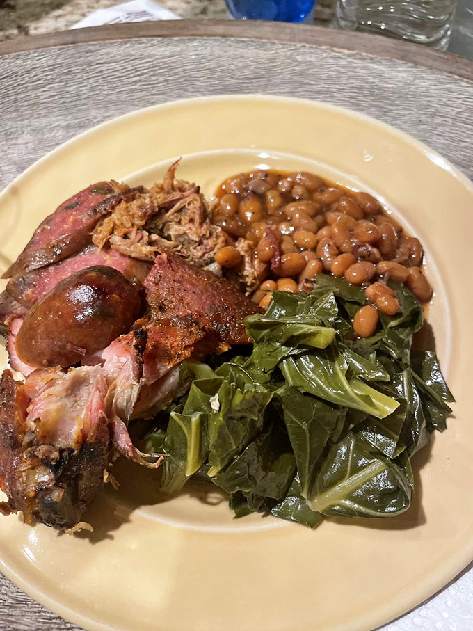 Southern hospitality on a plate &ndash; tender smoked meats with beans and collard greens that would make any grandma proud.