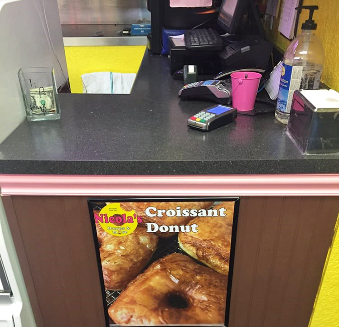 At the register, where hopes and dreams are exchanged for boxes of joy. The final checkpoint before donut nirvana.