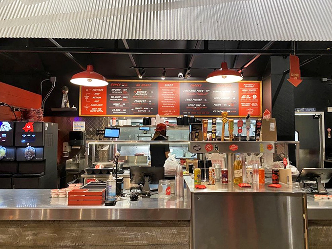 Behind the counter, where the magic happens. Like watching backstage at the Grand Ole Opry, but the stars are crispy and come with sides.