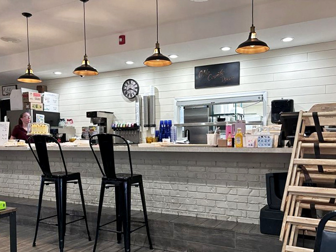 The counter area gleams with promise, where pendant lights cast a warm glow over the command center of comfort food operations.