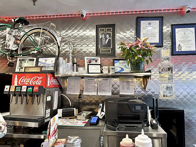 The counter where breakfast dreams come true, complete with those spinning red stools that make everyone feel like they're eight years old again, regardless of their actual age.