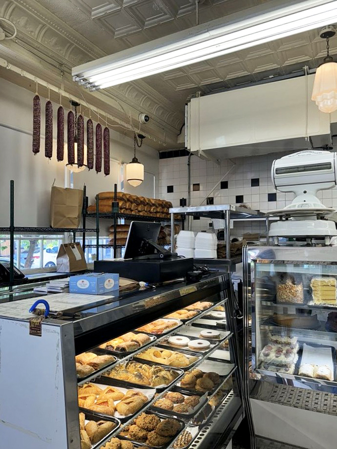 Salamis hanging like delicious stalactites and pastry cases brimming with carb-loaded treasures – this counter area is where diet plans go to surrender.