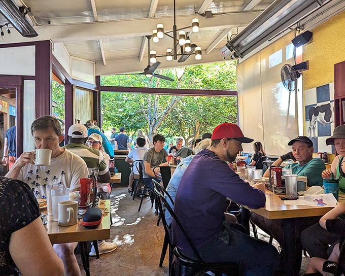 Where strangers become friends over coffee mugs the size of soup bowls and conversations that flow as freely as the refills.