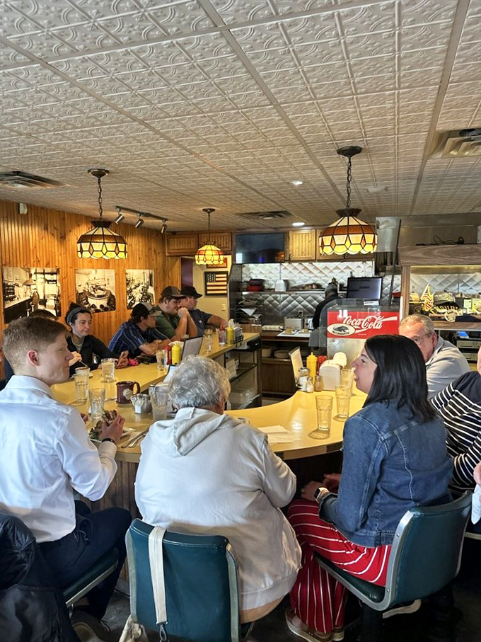 The counter fills with devoted diners, united in pursuit of butter burger bliss. Some relationships last decades; others, just one perfect meal.