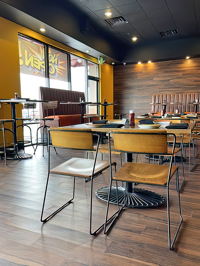 Industrial-chic meets comfort in this dining area where every seat offers the perfect vantage point for the main event&mdash;burger consumption.