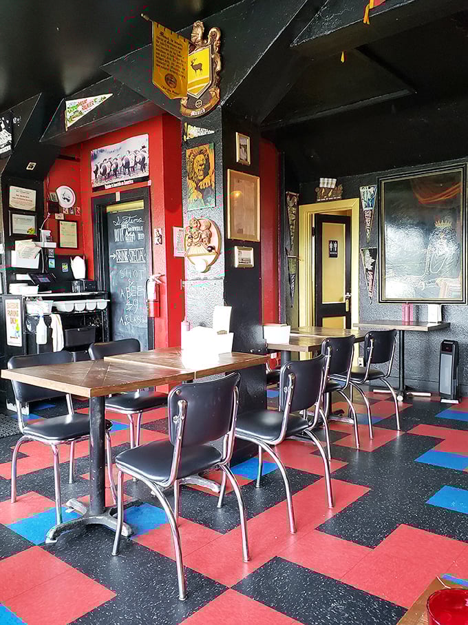 Retro diner meets eclectic art gallery in this cozy dining space where every seat promises both comfort and character.