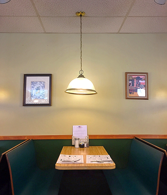 The quintessential diner booth&mdash;where countless coffee refills and life-changing conversations happen under soft pendant lighting.
