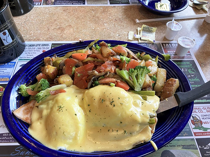 This isn't just food—it's architecture. Layers of flavor topped with hollandaise sauce that's clearly been getting its beauty sleep.