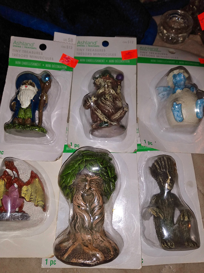 Miniature worlds with maximum charm. These tiny figurines prove that sometimes the smallest treasures create the biggest smiles when discovered on a dusty market table.