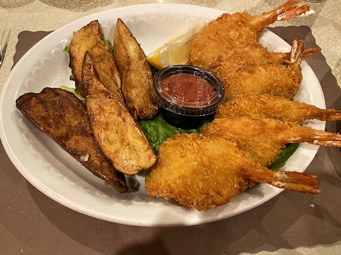 Fried shrimp and potato wedges arranged with the kind of care that suggests someone in the kitchen really, truly wants you to be happy.