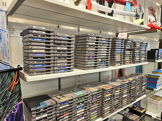 Vintage gaming cartridges stacked like historical artifacts, where Gen-X nostalgia meets bargain hunting in an unexpected corner of the outlets.