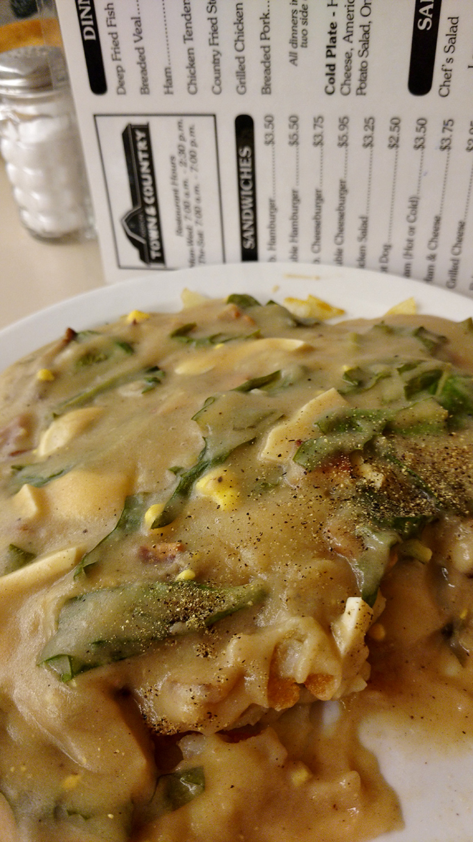 This isn't just gravy&mdash;it's a savory masterpiece with vegetables peeking through like hidden treasures. Comfort food that demands to be sopped up with bread.