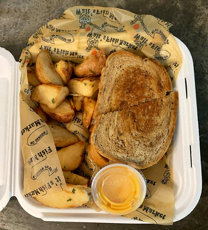 The sandwich and potatoes arrive on branded paper &ndash; a meal that speaks of tradition, simplicity, and flavors that don't need fancy china to impress.
