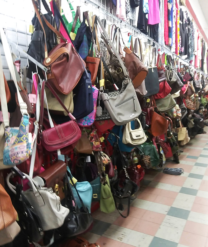 Handbags dangling like colorful fruit, ripe for the picking. That leather Coach might be the best twenty bucks you'll ever spend.