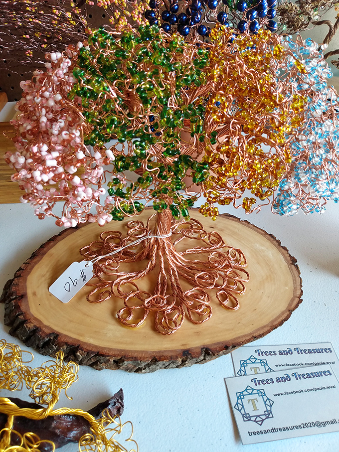 Wire trees bloom with beaded leaves, proving that art finds its way even into the most unexpected corners of West Virginia.
