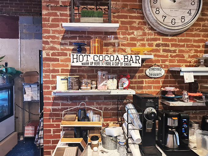 The hot cocoa bar isn't just a drink station&mdash;it's a winter survival kit. "Warm up here & have a cup of cheer" indeed!