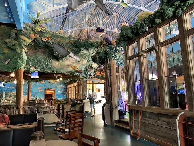 Dining beneath an aquatic canopy makes even waiting for your food an adventure. The fish aren't real, but your hunger certainly is.