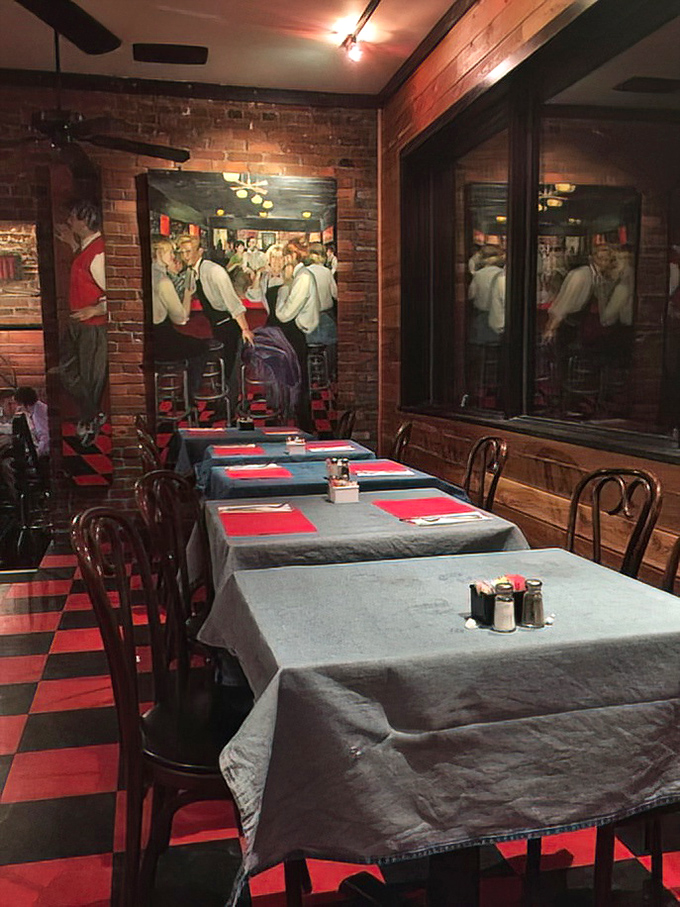 Red tablecloths and brick walls create the kind of timeless dining room where memories are made between bites of legendary burgers.