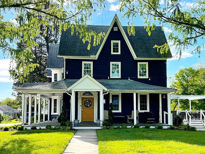 This striking navy Victorian with its sunny yellow door proves that Berlin residents understood curb appeal long before HGTV made it a national obsession.