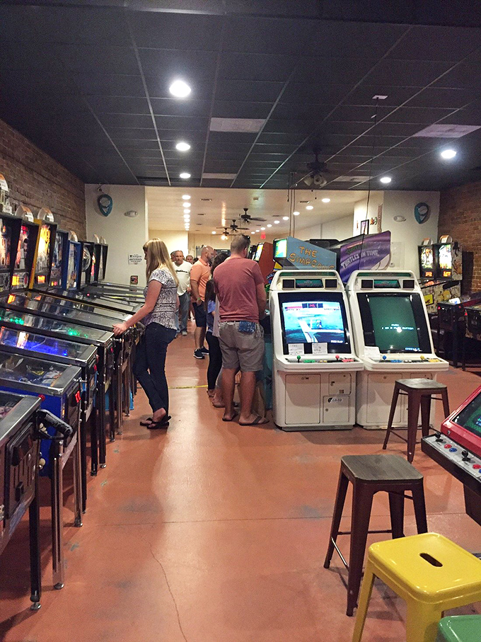 The perfect rainy day escape in Tarpon Springs. Visitors navigate the narrow aisles like pinballs themselves, bouncing between decades of electronic entertainment.
