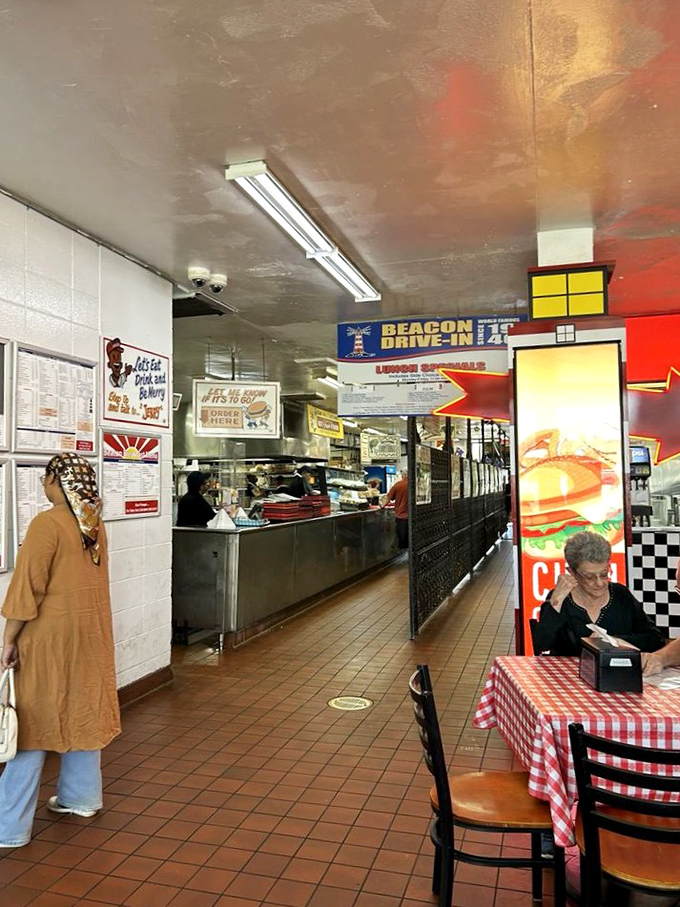 Inside The Beacon, where the d&eacute;cor hasn't changed in decades because perfection doesn't need updating. Note the bags of onions&mdash;promises of crispy rings to come.
