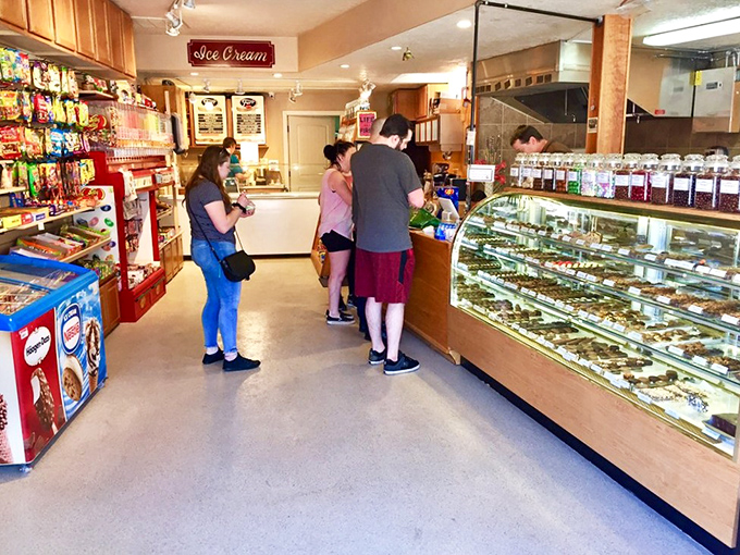 Decision paralysis has never been sweeter. Customers contemplate life's most important question: which chocolate masterpiece deserves to come home?