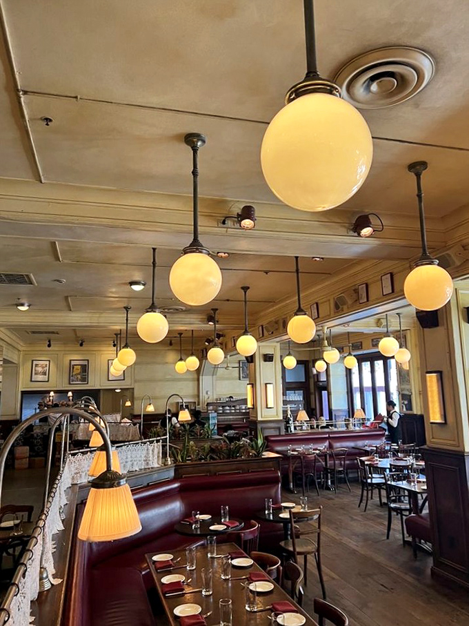 Globe lights suspended from the ceiling create that magical Parisian ambiance where everyone looks good and the food tastes even better.