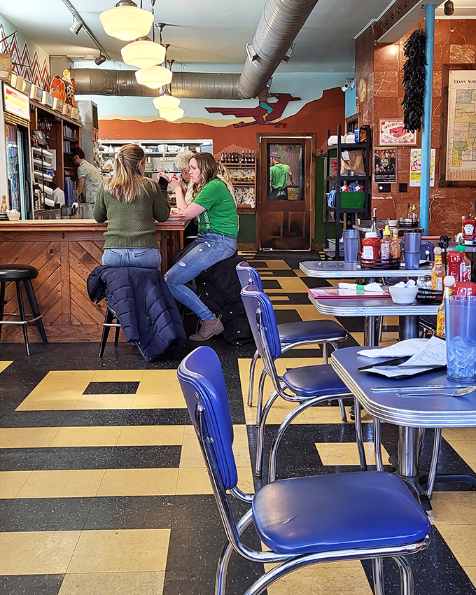 Inside Southwest Diner, where the counter seats offer front-row tickets to the breakfast theater and the checkered floor keeps your eyes dancing.