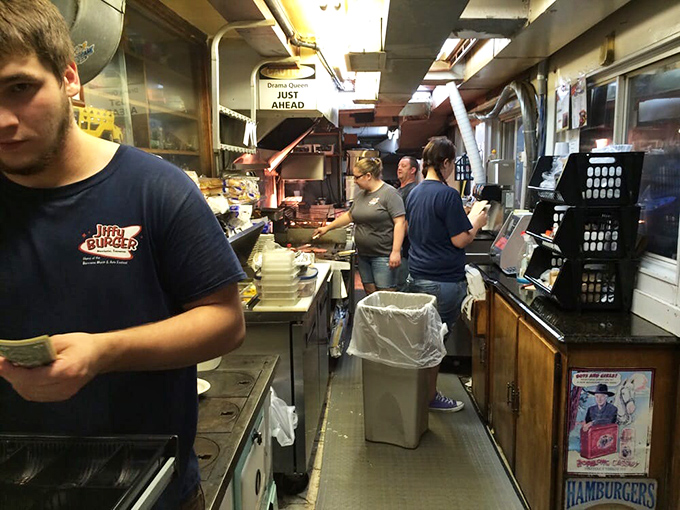 The kitchen reveals the choreographed dance of short-order cooking. No fancy equipment, just well-seasoned surfaces and muscle memory perfected over thousands of burgers.
