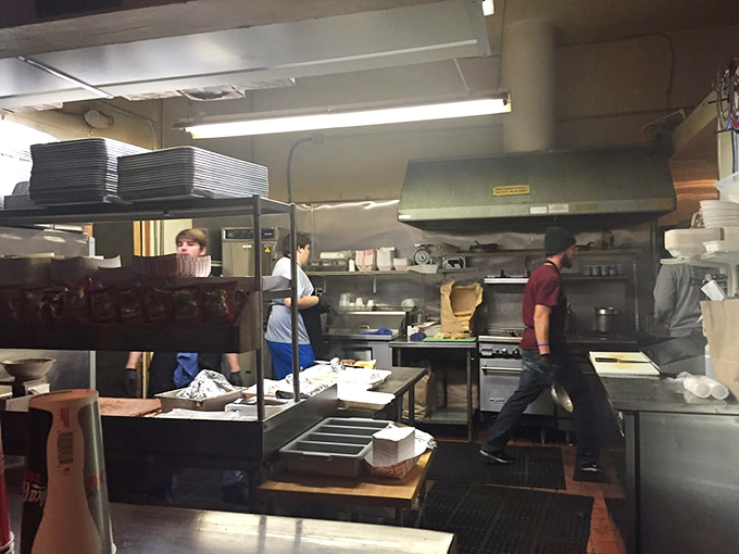 A glimpse into the kitchen where the magic happens. No wizards, just dedicated folks who understand the alchemy of smoke, meat, and time.