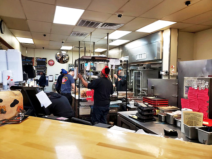 Behind the scenes where smoke and patience work their magic. The kitchen crew orchestrates a symphony of slow-cooked perfection.