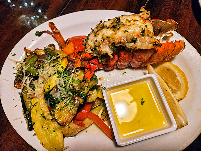 This lobster tail isn't just dinner&mdash;it's a crustacean celebration atop a colorful medley of vegetables that brighten the plate and the palate.