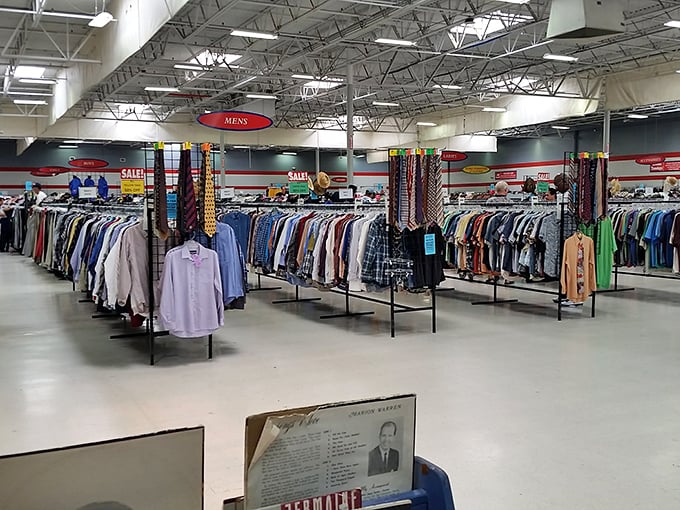 Ties that once cinched business deals hang alongside shirts that might have seen everything from boardrooms to backyard barbecues.