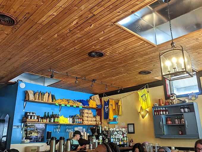 The blue wall shelf displays merchandise and supplies&mdash;like a treasure trove of breakfast possibilities waiting to happen.